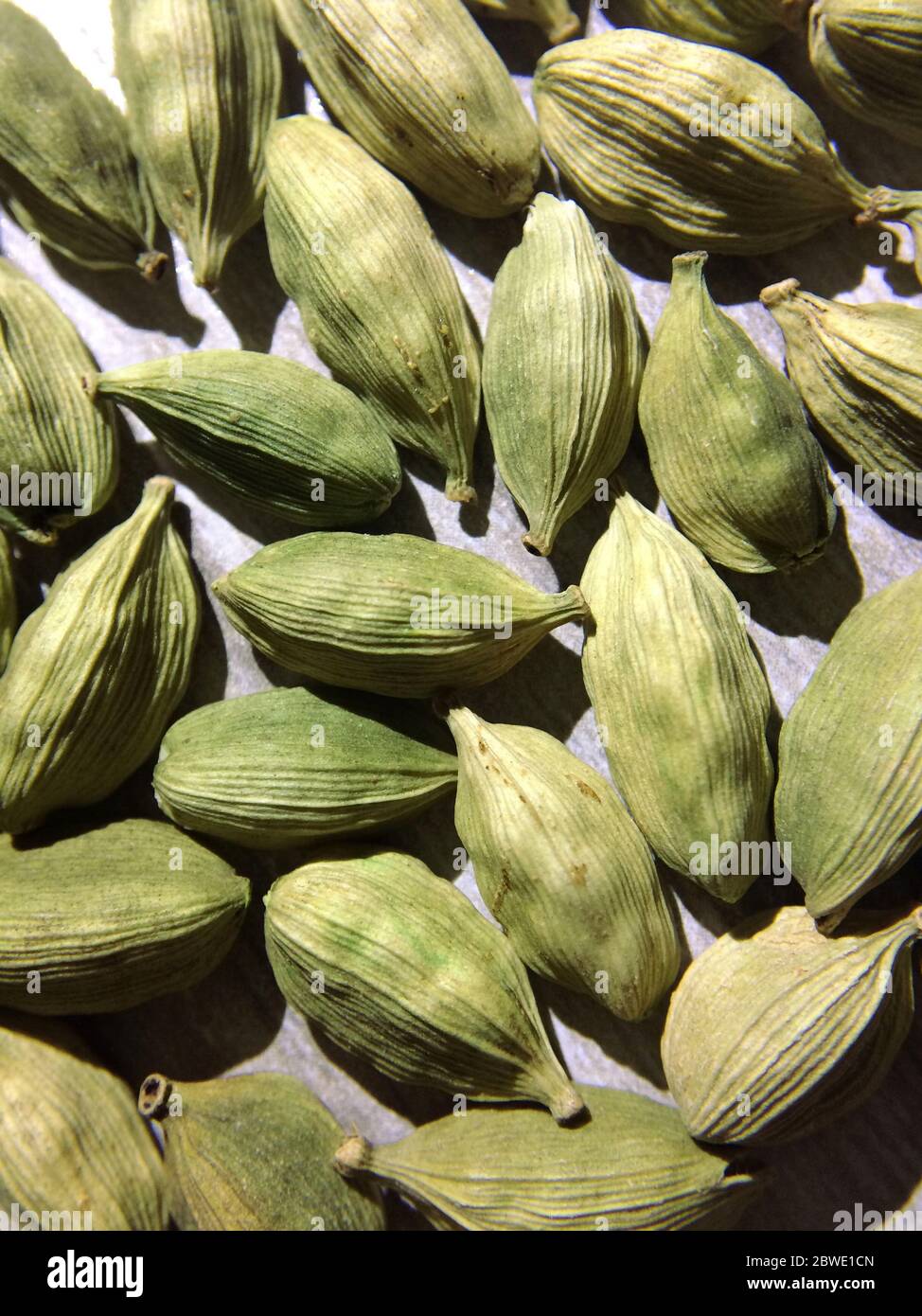 Green cardamom pods background. Vertical image. Close up. Healthy food ...