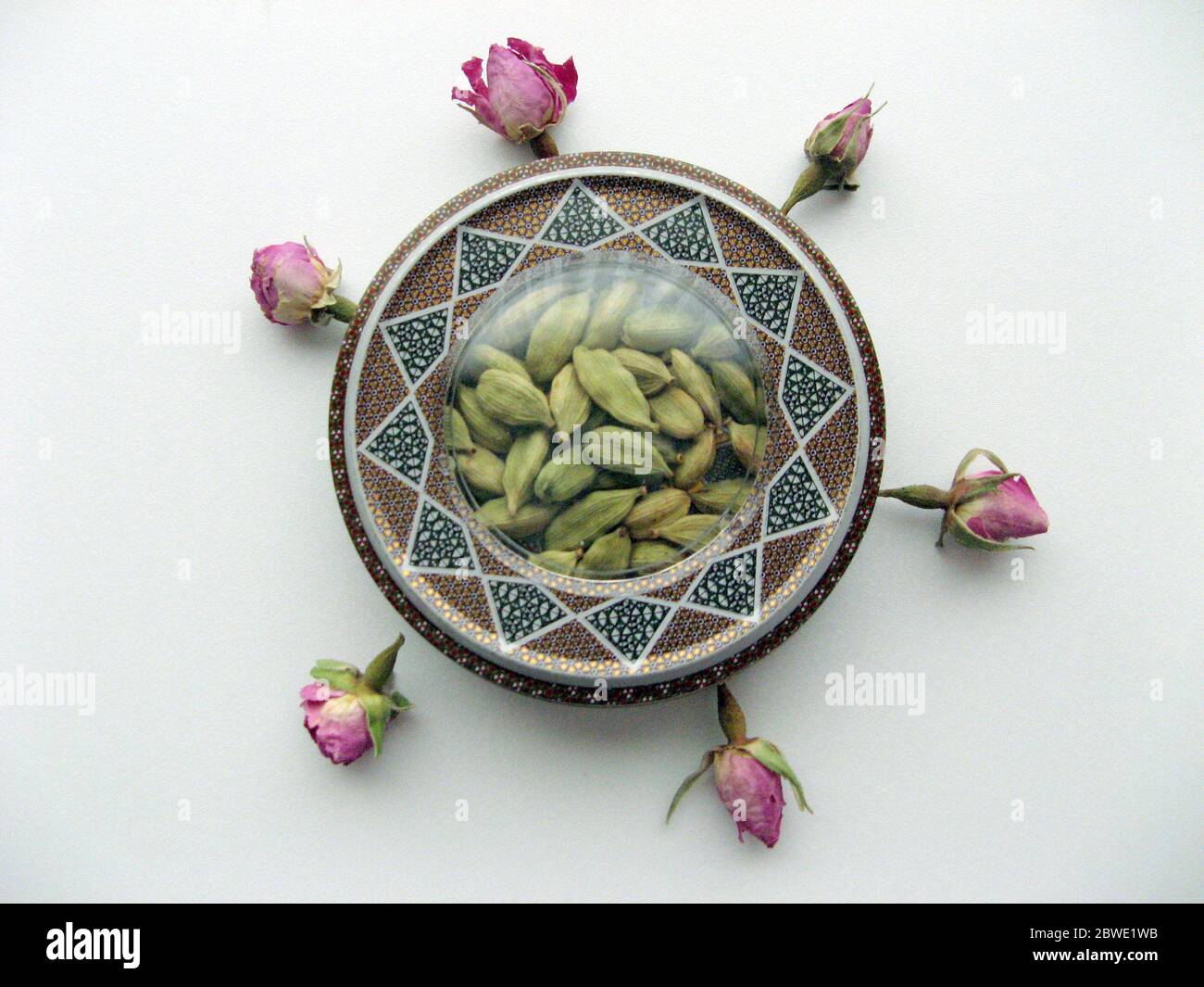 mashhad, IRAN, 01 03 2020: Green cardamom pods into beautiful handcraft ...
