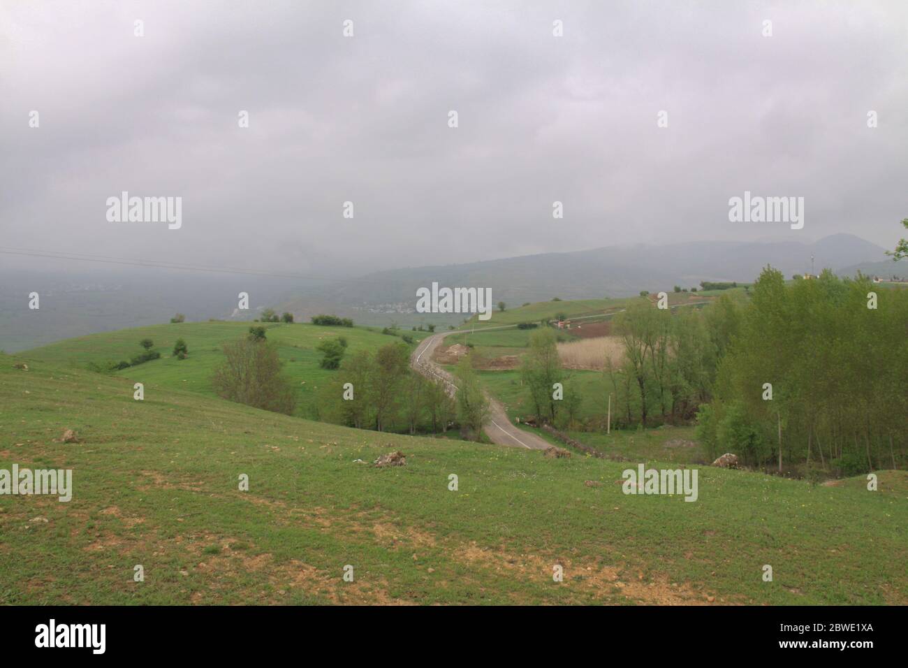 A beautiful plain with a road from it, Iran, Gilan Stock Photo - Alamy