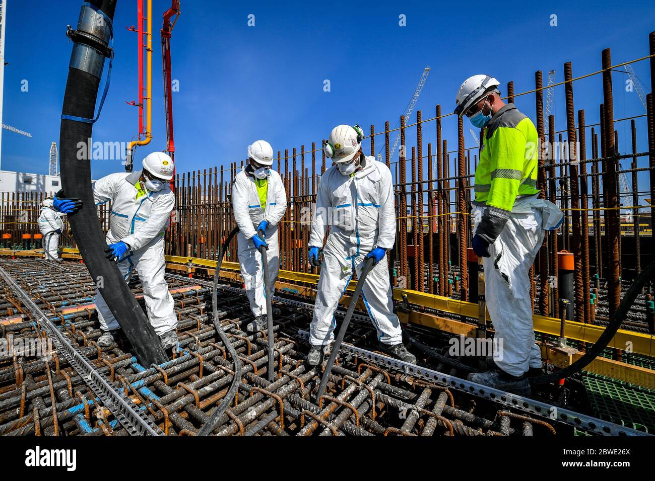 Concrete pouring teams wear extra PPE as they must work closely as a ...