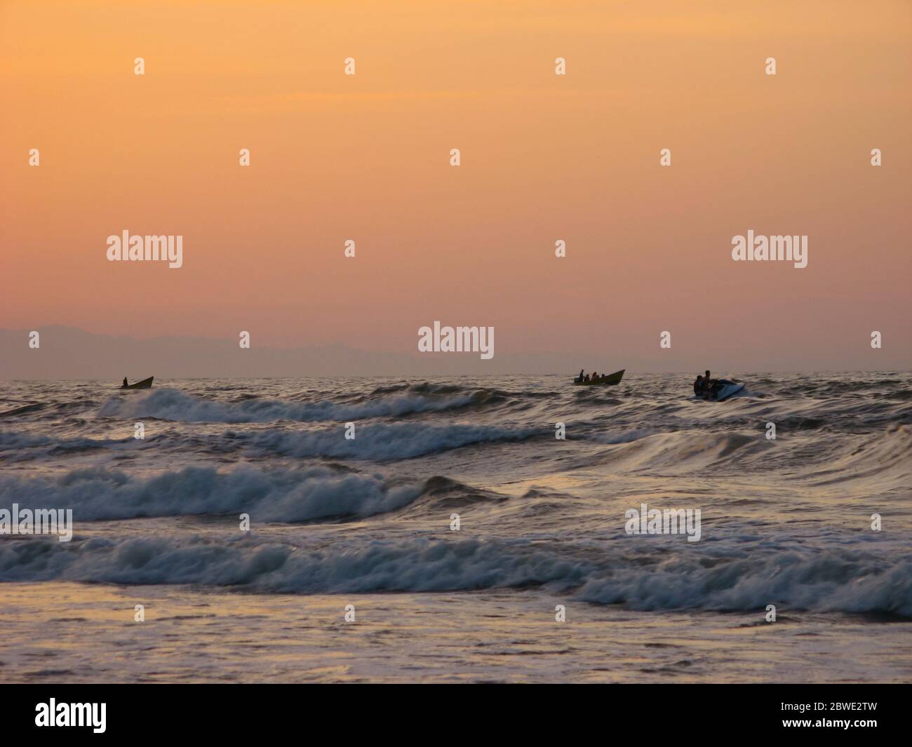 boat in sea Sunset . Yellow sunset sky over the sea. Golden time of sky ...