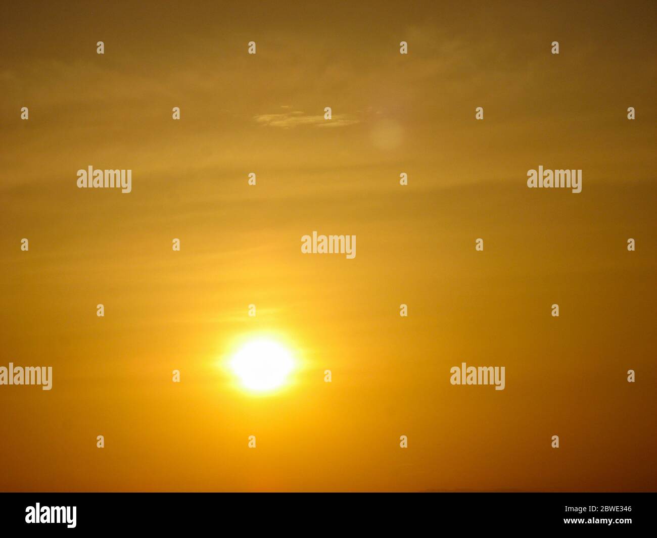 Sunset sky abstract background. Yellow sunset sky over the sea. Golden ...