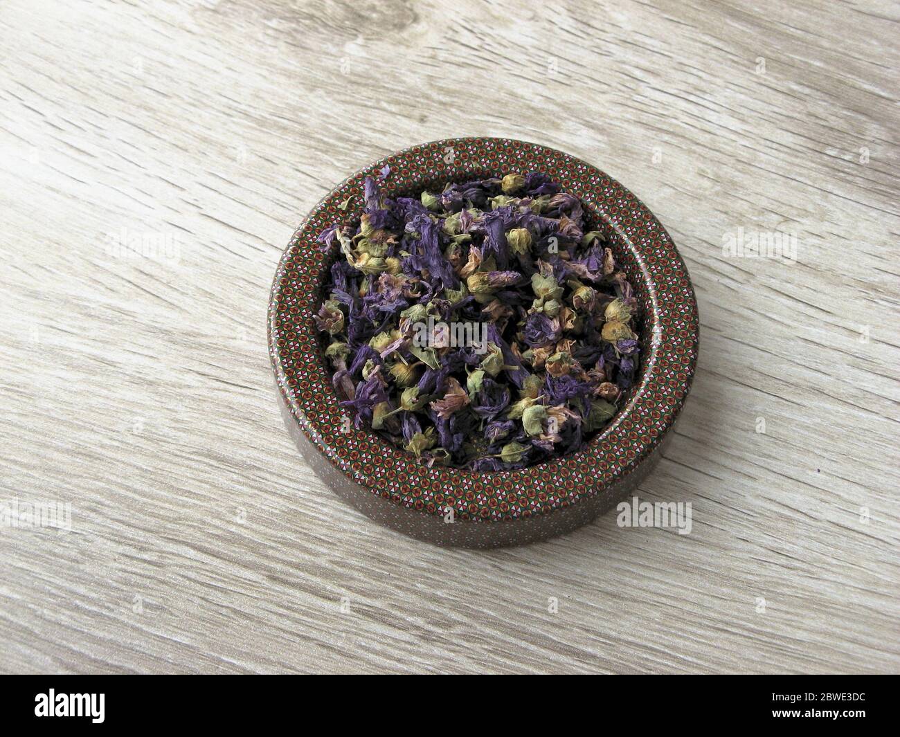 Dried flowers of malva sylvestris mauritian on wooden background ...