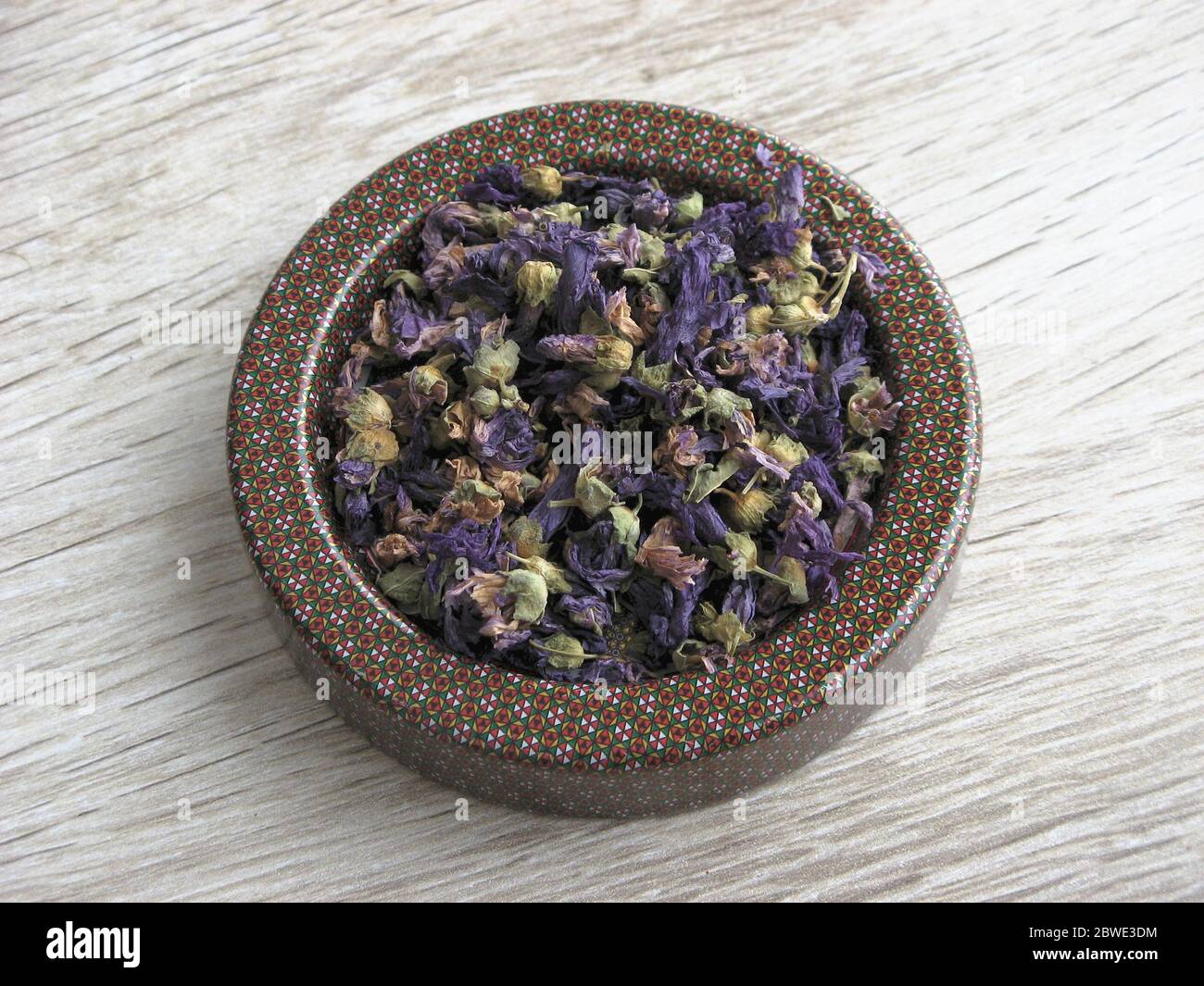 Dried blossoms of malva sylvestris mauritiana in dish, a variety of ...