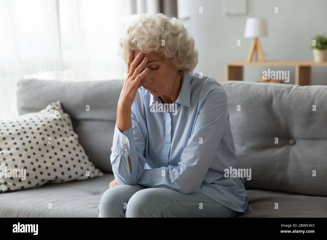 Elderly woman lost in sad thoughts feels miserable and lonely Stock ...