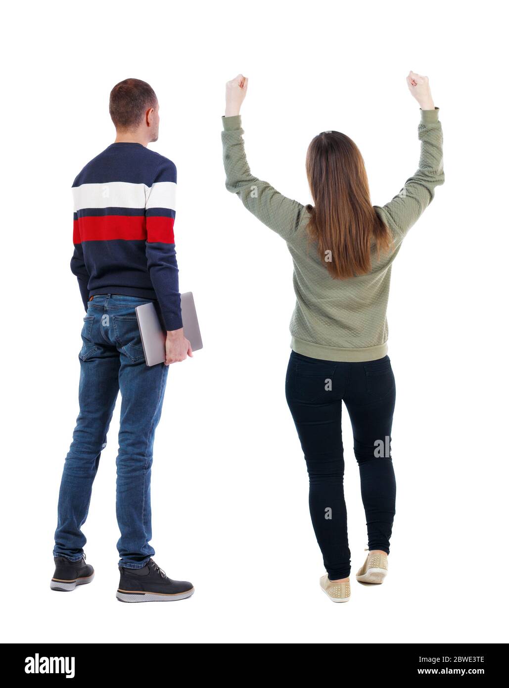 Back view couple with laptop in sweater. beautiful man and woman. Rear ...