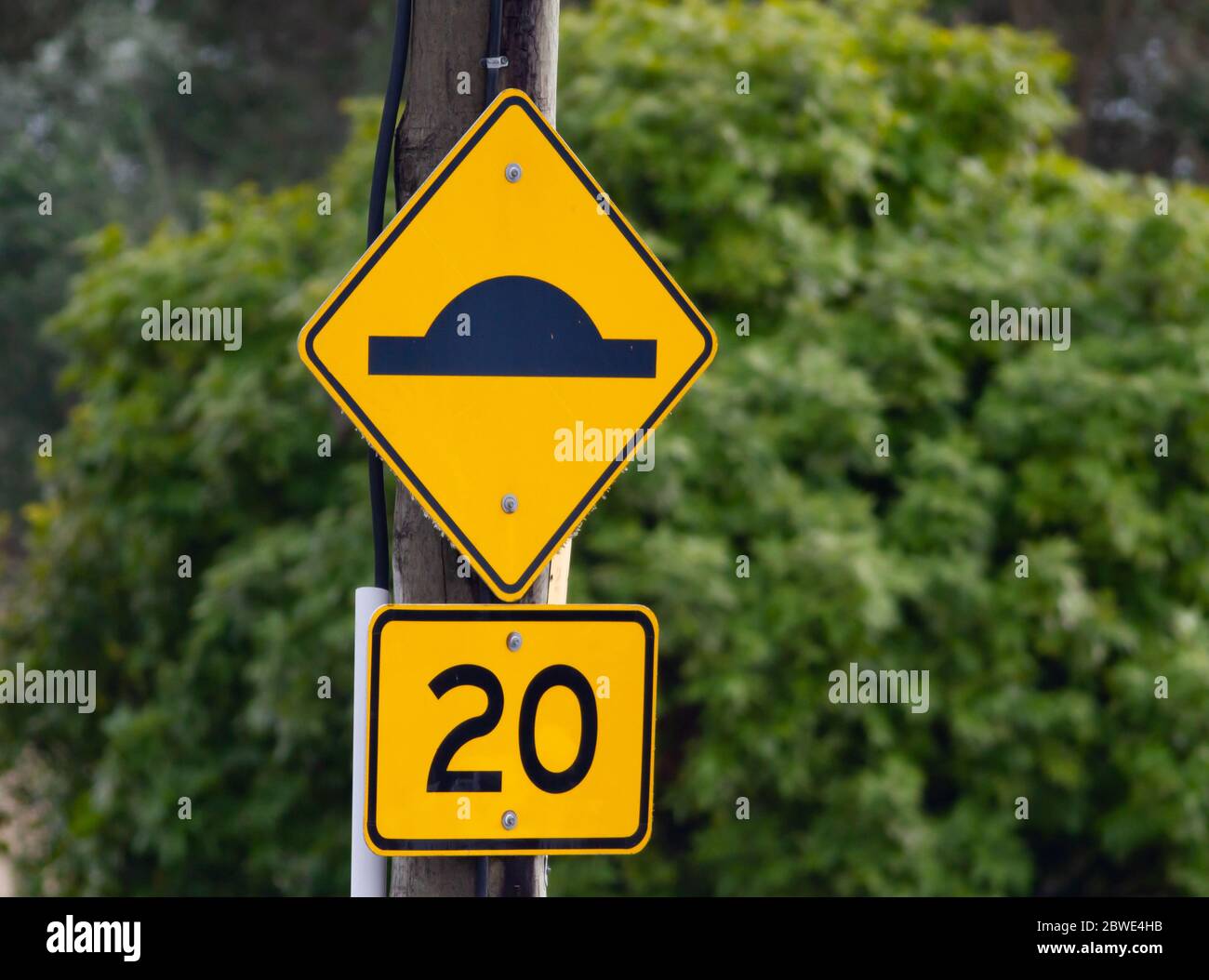 Road signs on an electric post Stock Photo - Alamy