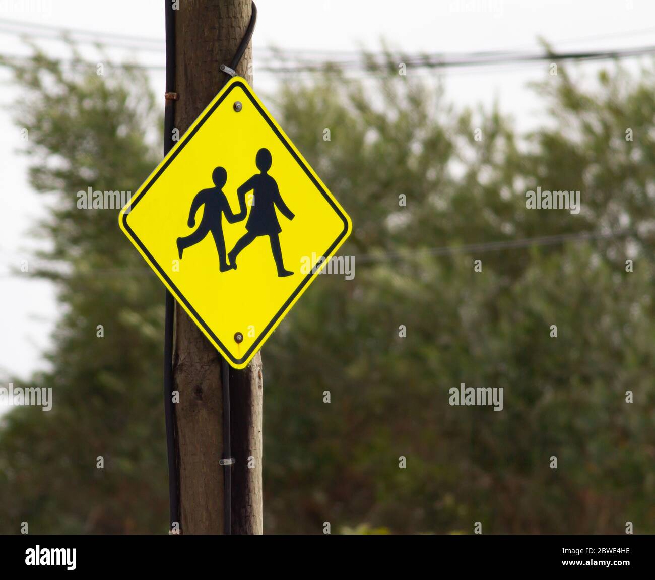 Road signs on an electric post Stock Photo - Alamy