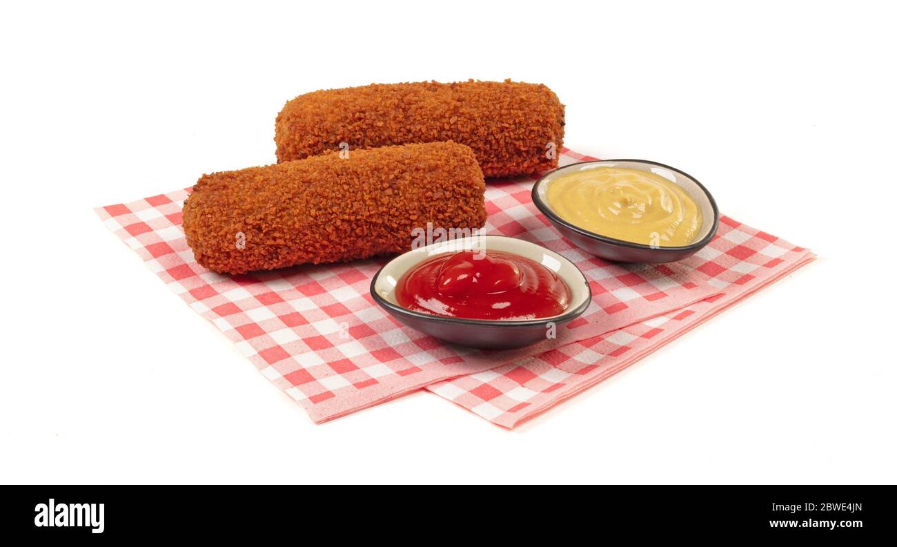 Brown crusty dutch kroket with sauces (mustard and ketchup) isolated on ...