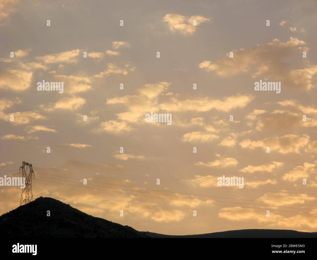 Powerline with sunset cloudy sky. Sunset sky background -orange and ...