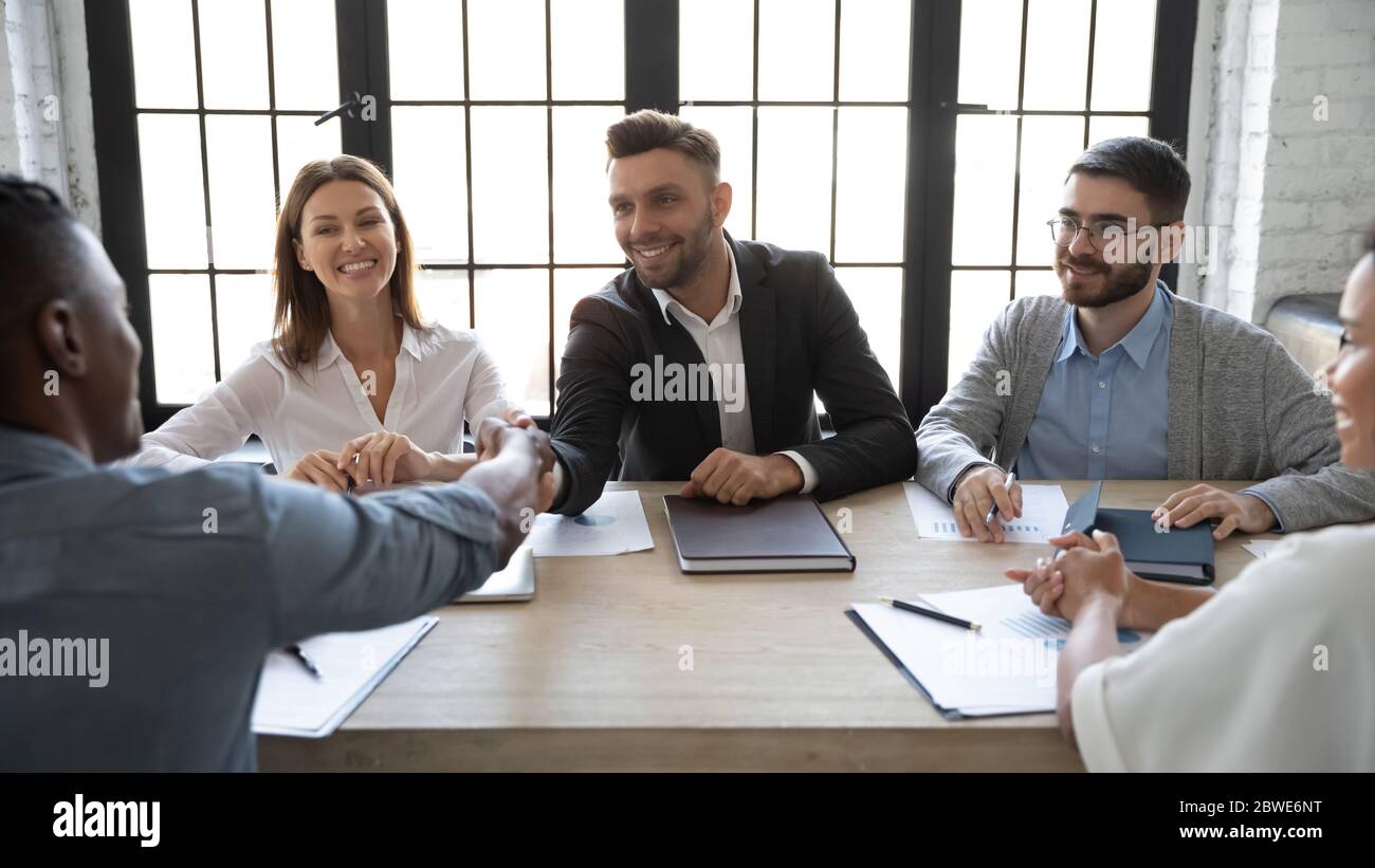 Diverse business people sitting table hi-res stock photography and ...