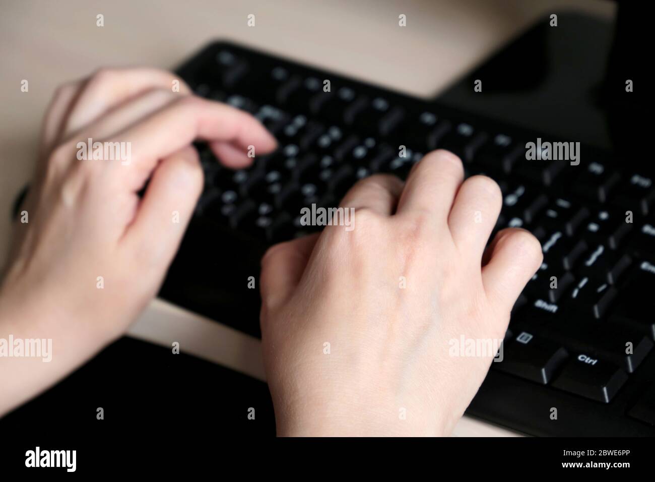 Black woman typing at computer hi-res stock photography and images - Alamy