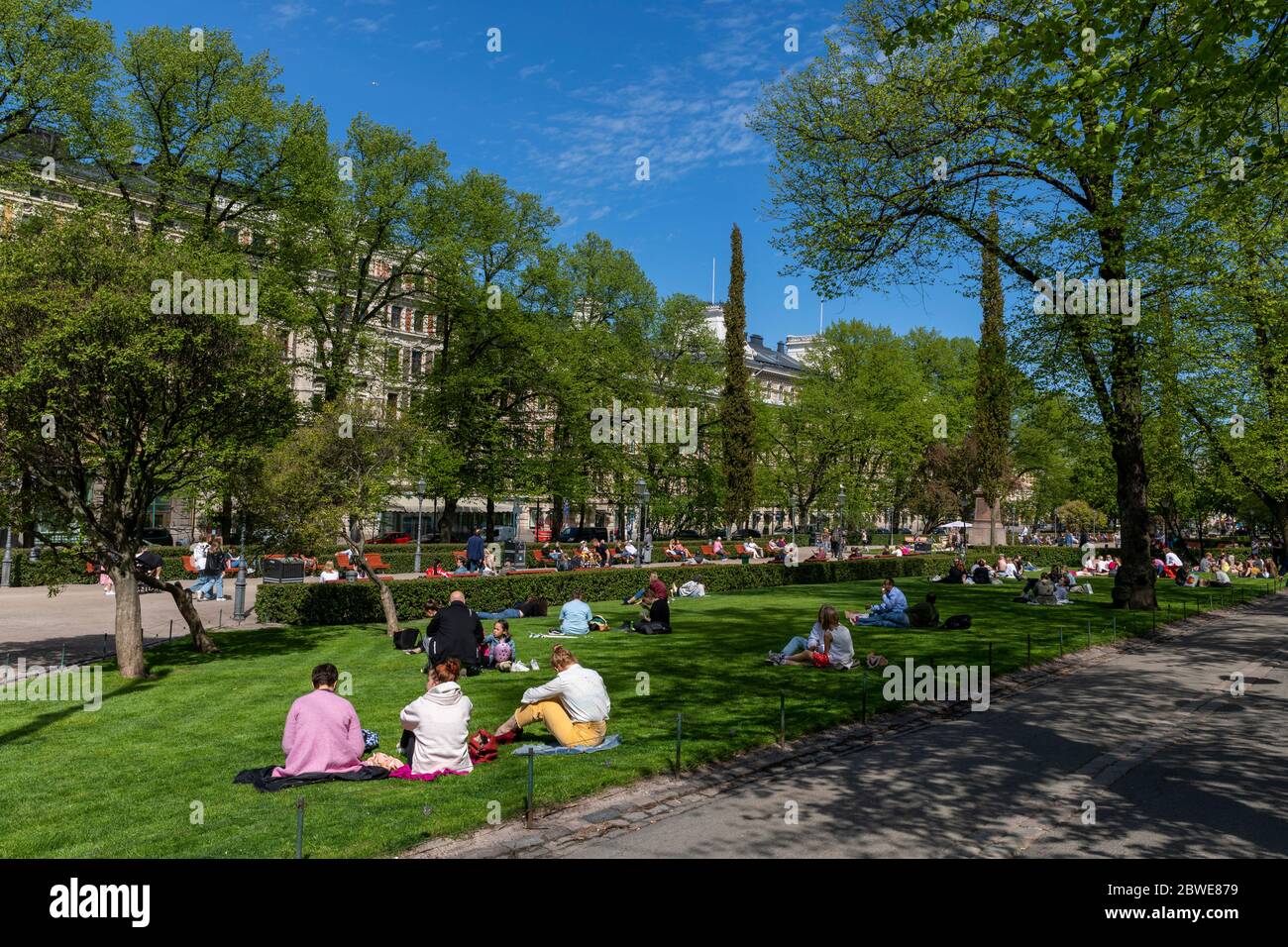 Warm summer weather is tempting people to gather in public parks in ...