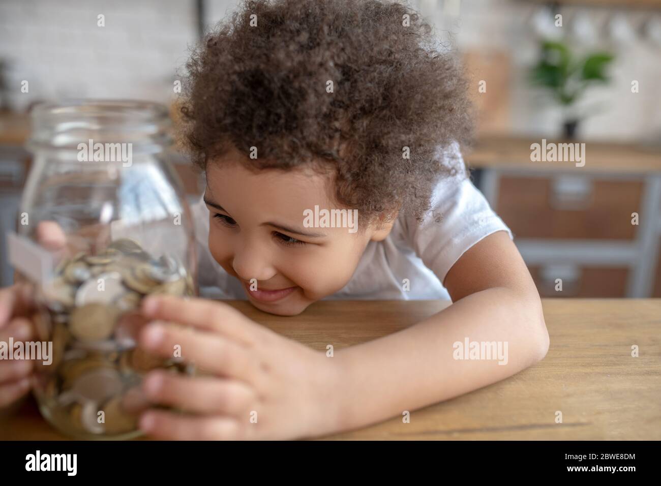 African Kid Holding Money High Resolution Stock Photography and Images ...