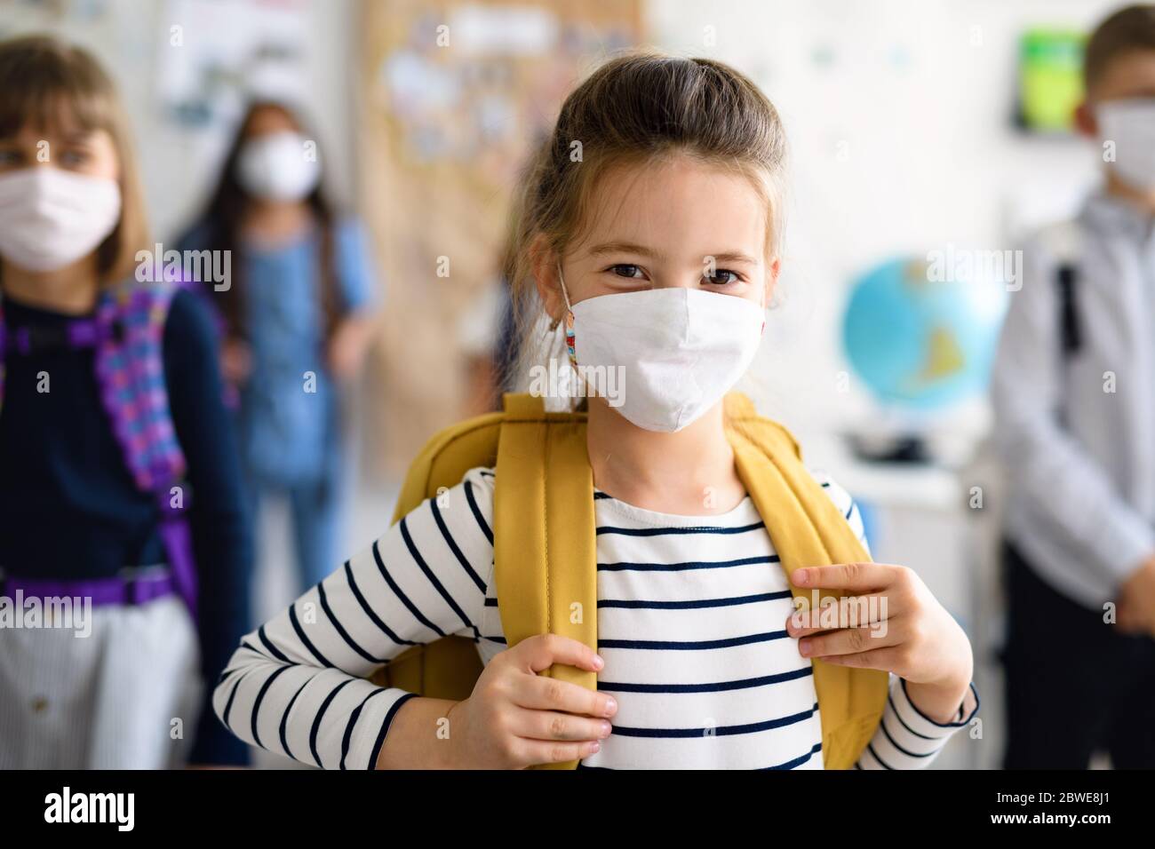 Child with face mask going back to school after covid-19 quarantine and ...