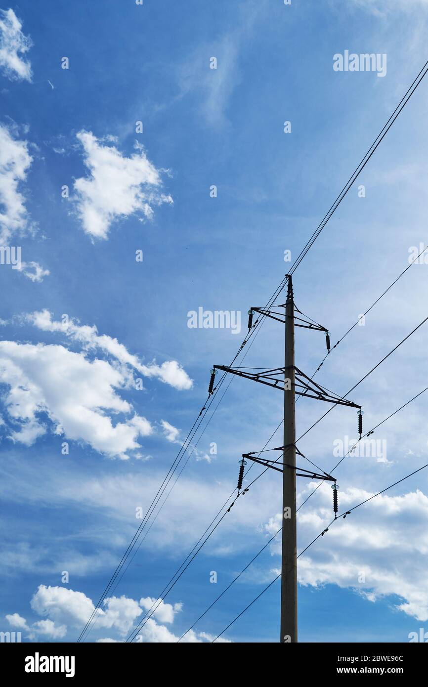 high-voltage electric line against a bright beautiful sky Stock Photo ...