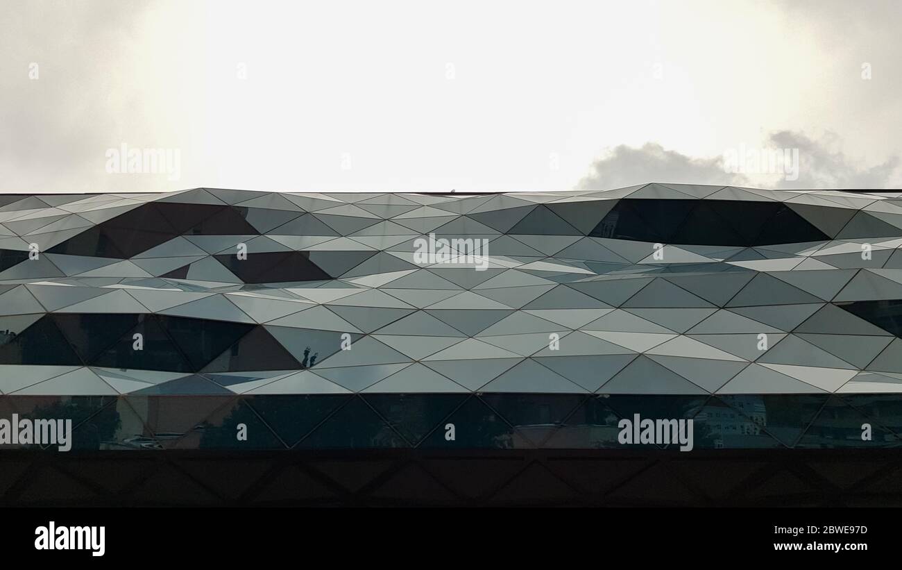 facade of a curved glass building. modern architecture. Unusual design ...