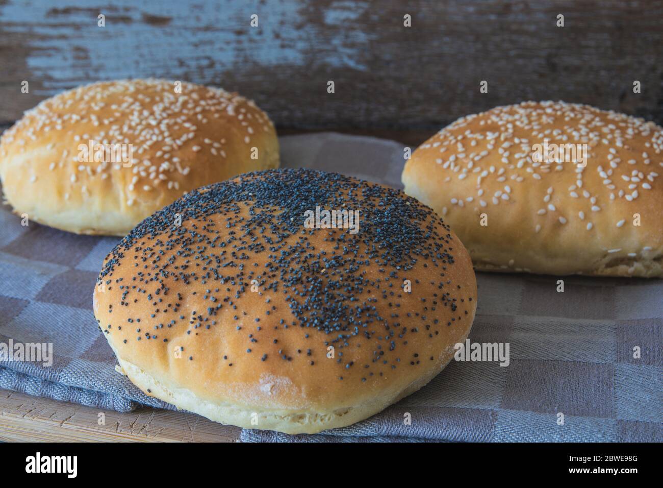 Homemade burger bread with poppy seeds and sesame Stock Photo - Alamy