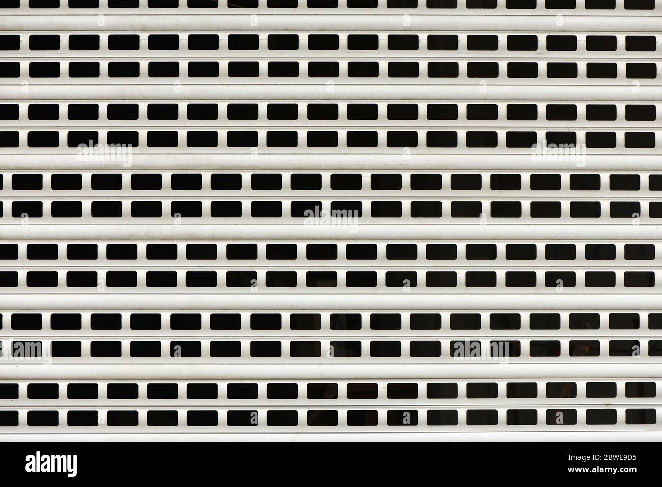 White garage door texture. Perforated metal garage door. High ...