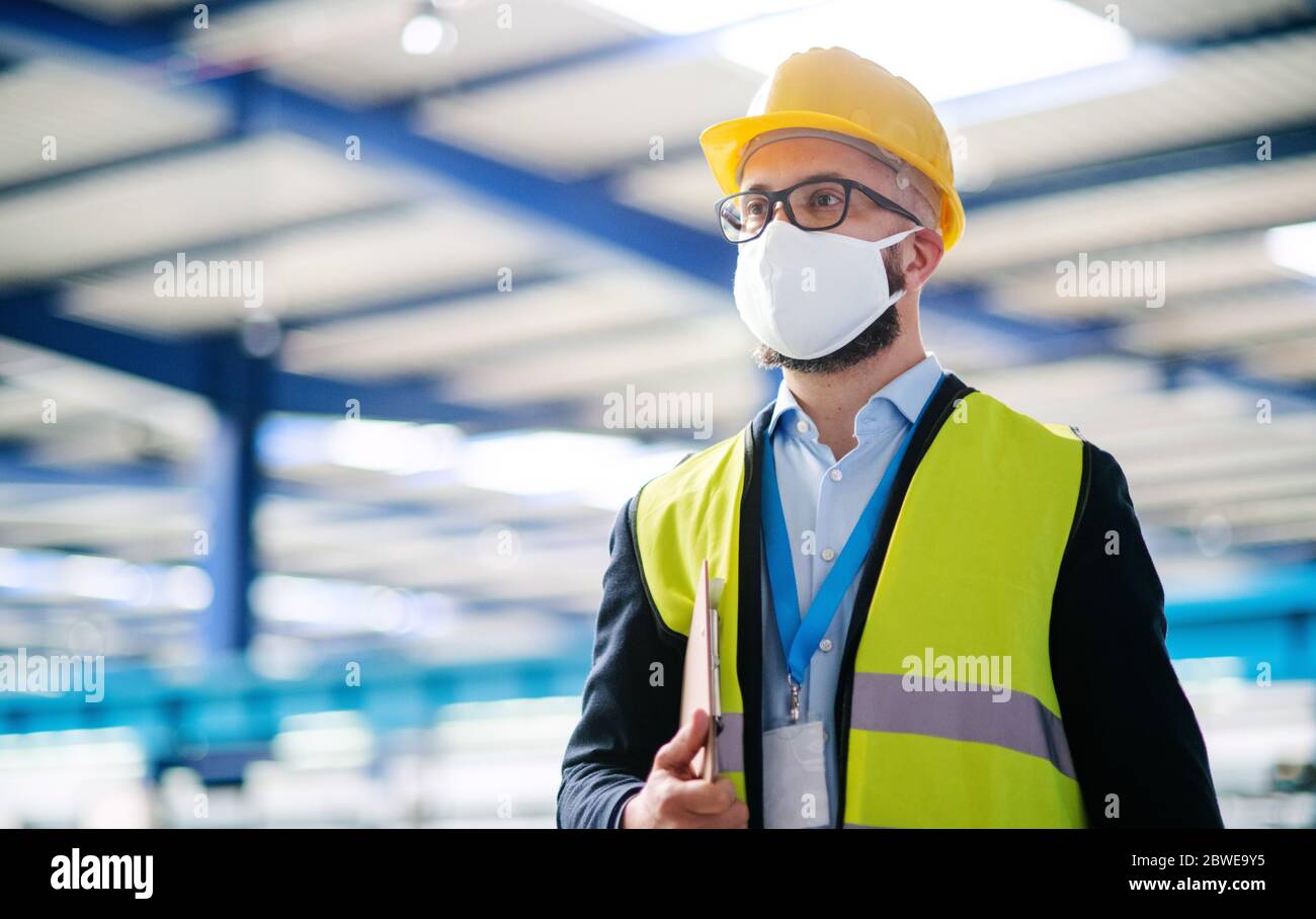 Engineer in suit holding helmet hi-res stock photography and images - Alamy