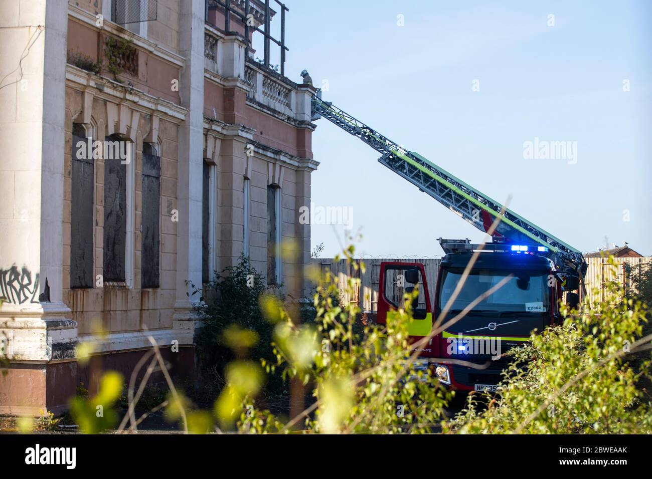 Northern Ireland Fire and Rescue Service firefighters tackling a large ...