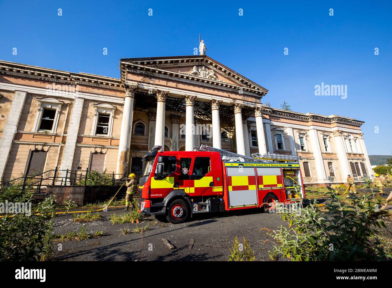 Northern Ireland Fire and Rescue Service firefighters tackling a large ...