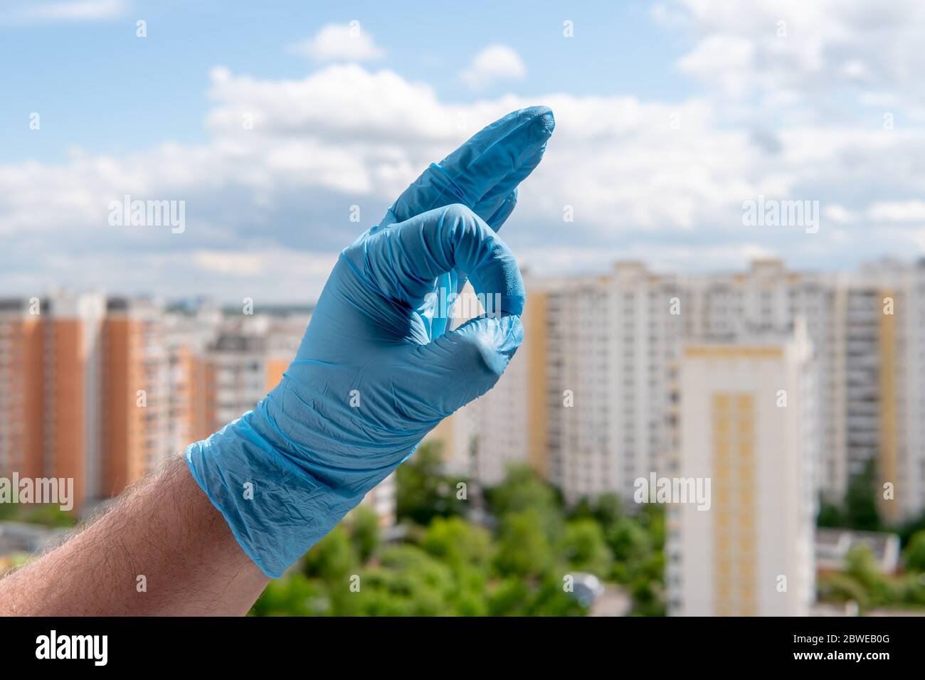 Medical glove stop blue background hi-res stock photography and images ...