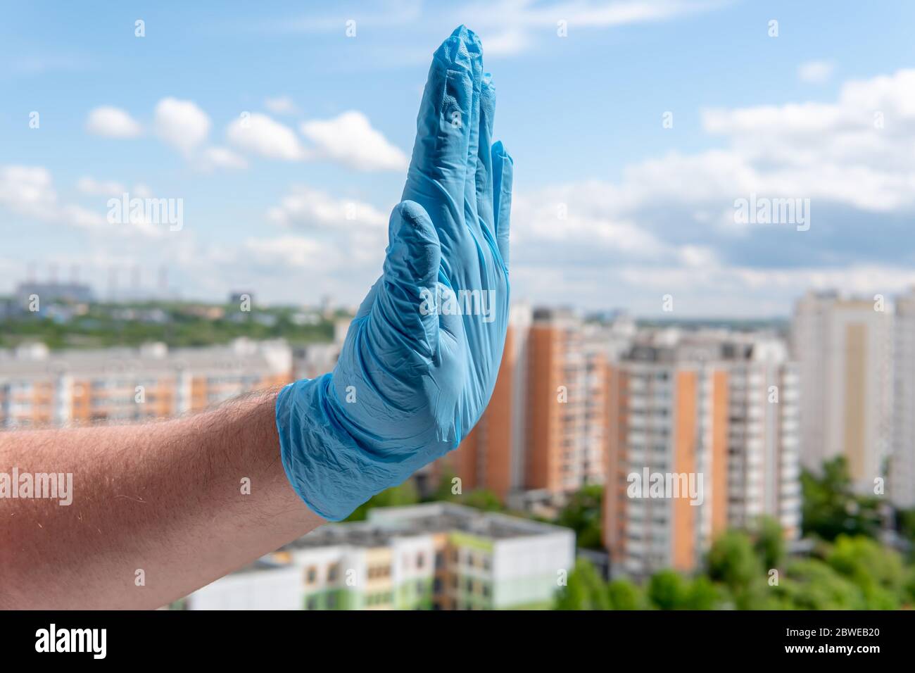 Medical glove stop blue background hi-res stock photography and images ...