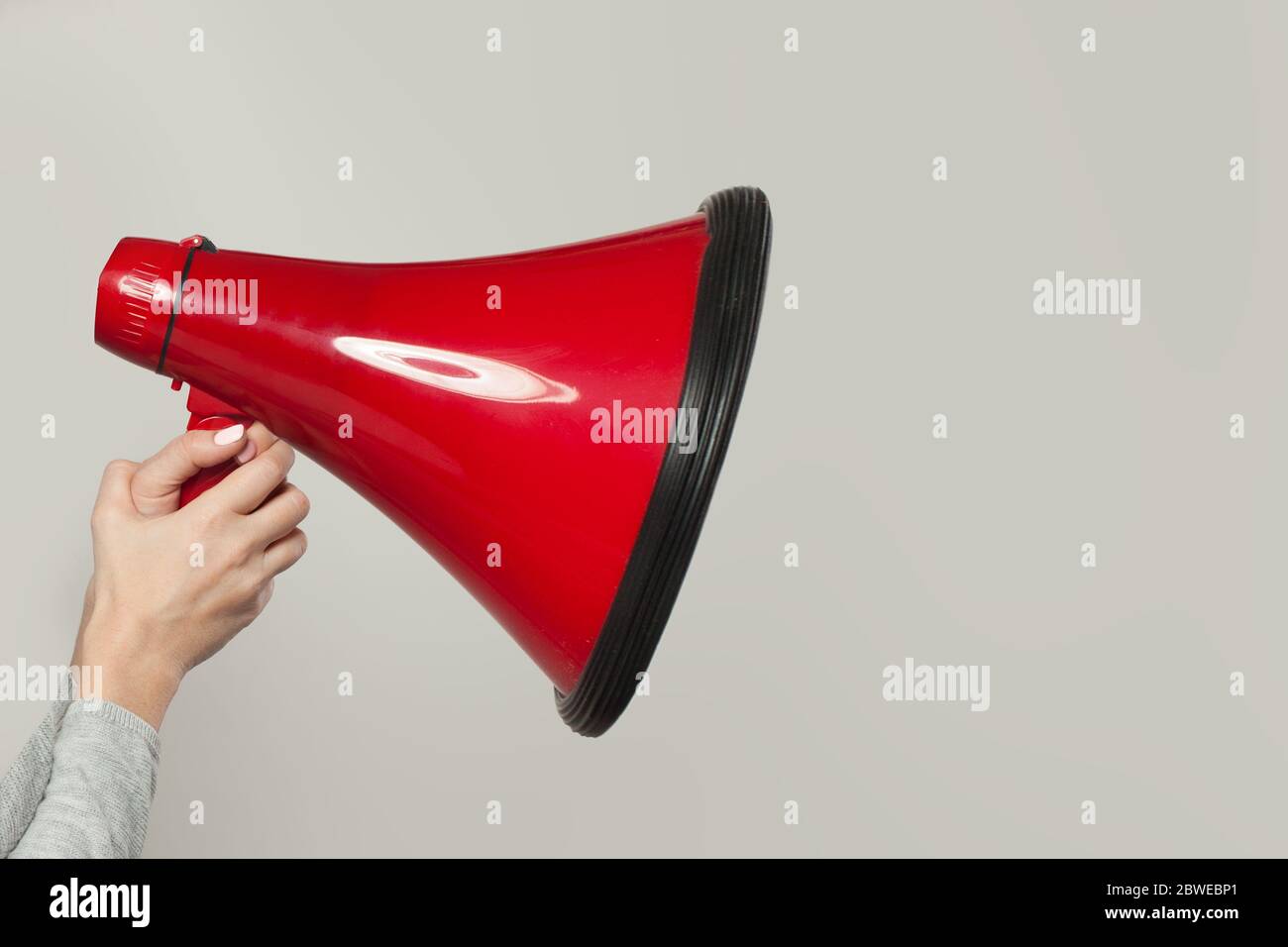 Red loudspeaker megaphone on white Stock Photo - Alamy