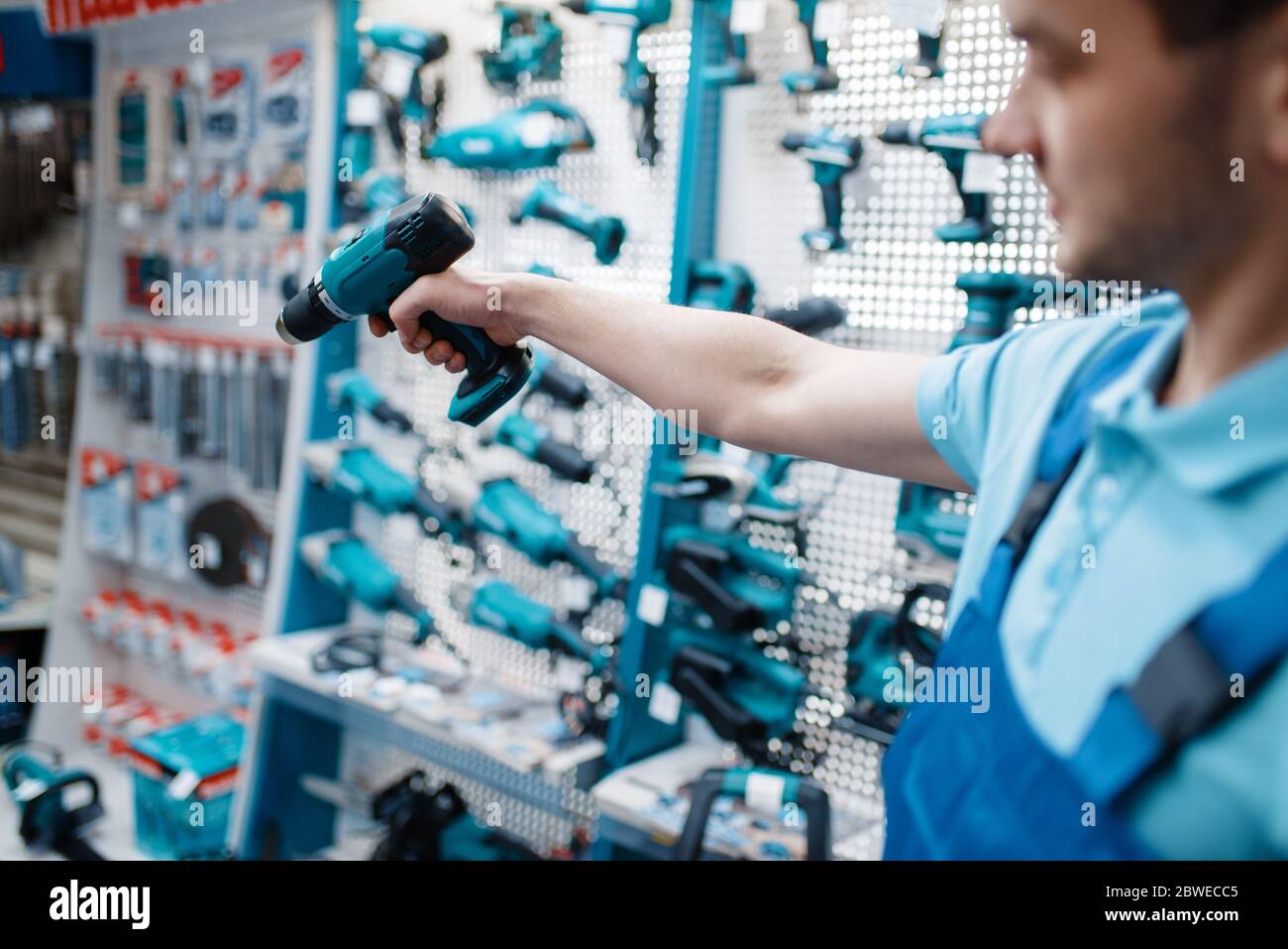 Portrait smiling man electric drill hi-res stock photography and images ...