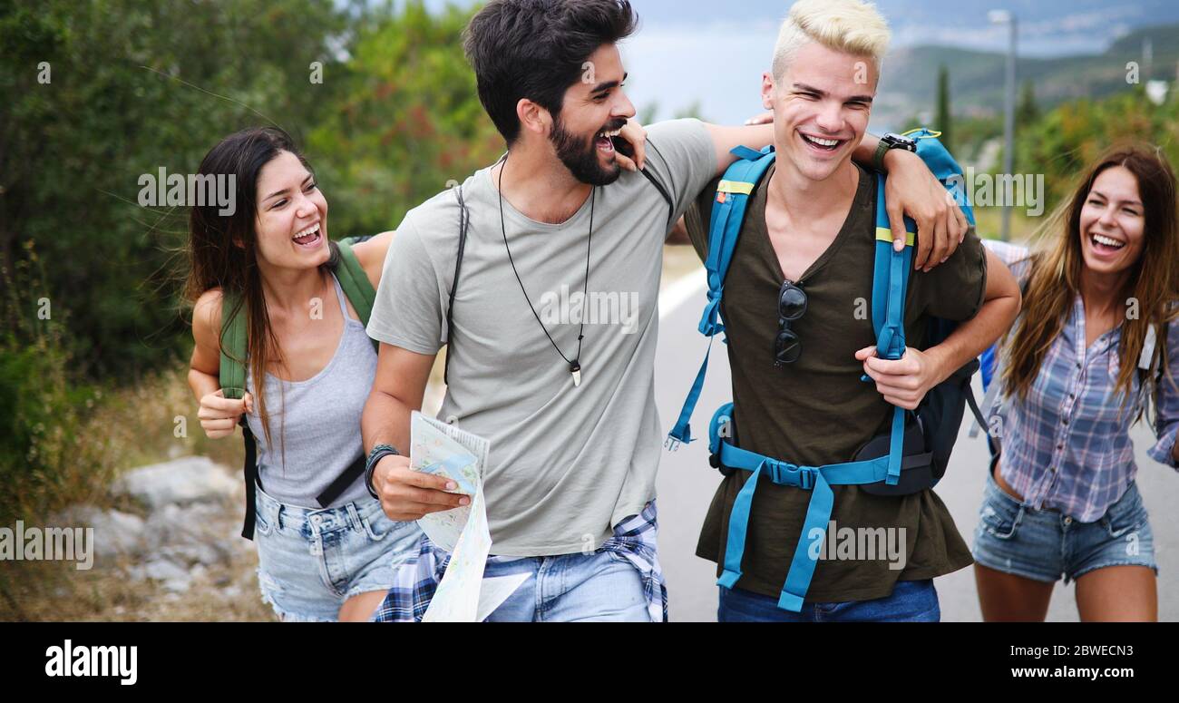 Group of happy friend traveler walking and having fun. Travel lifestyle ...