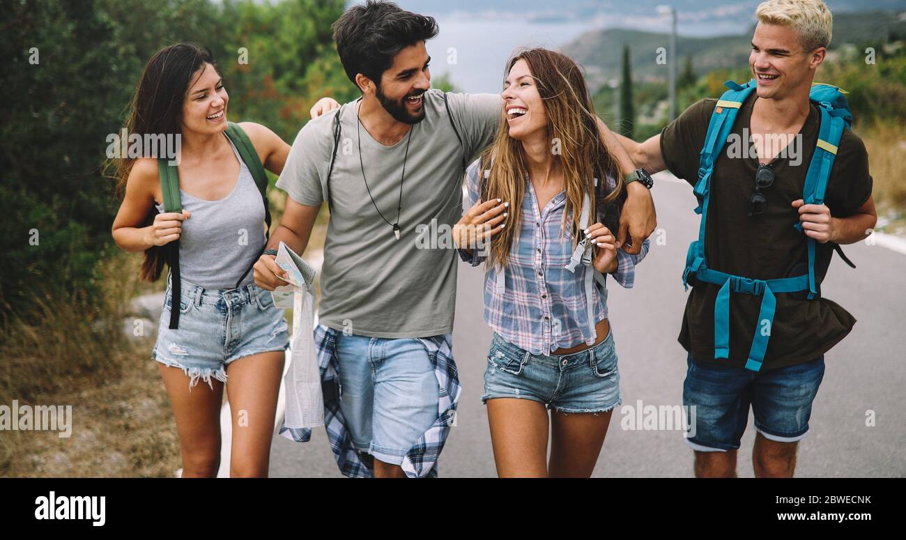 Group of friends with backpacks at summer outdoor. Travel concept Stock ...