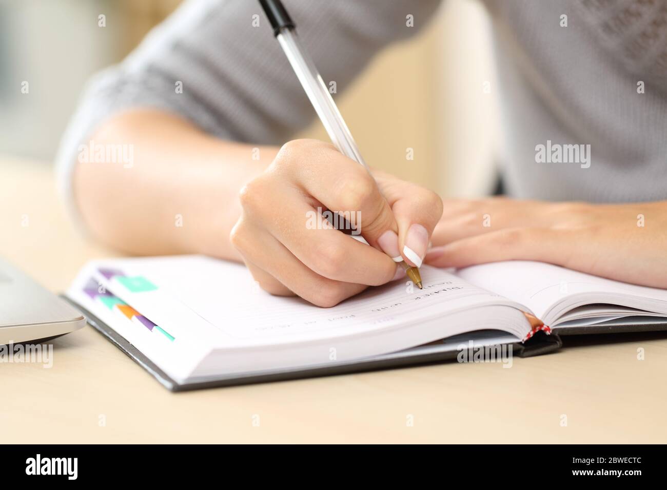 Woman writing a note hi-res stock photography and images - Alamy
