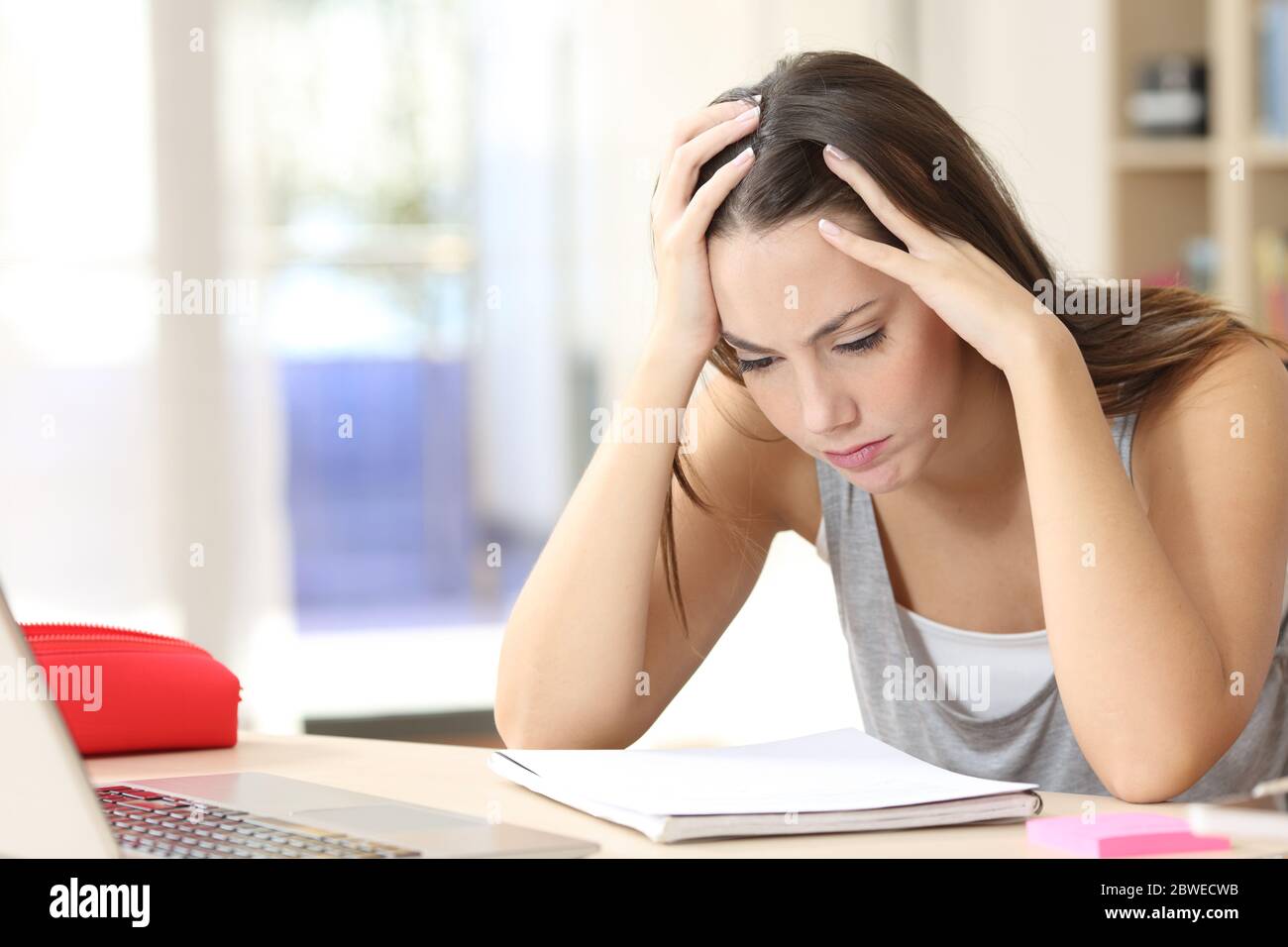 Frustrated teenage girl studying desk hi-res stock photography and ...
