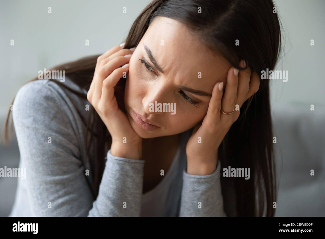 Close up face of worried sad young woman Stock Photo - Alamy