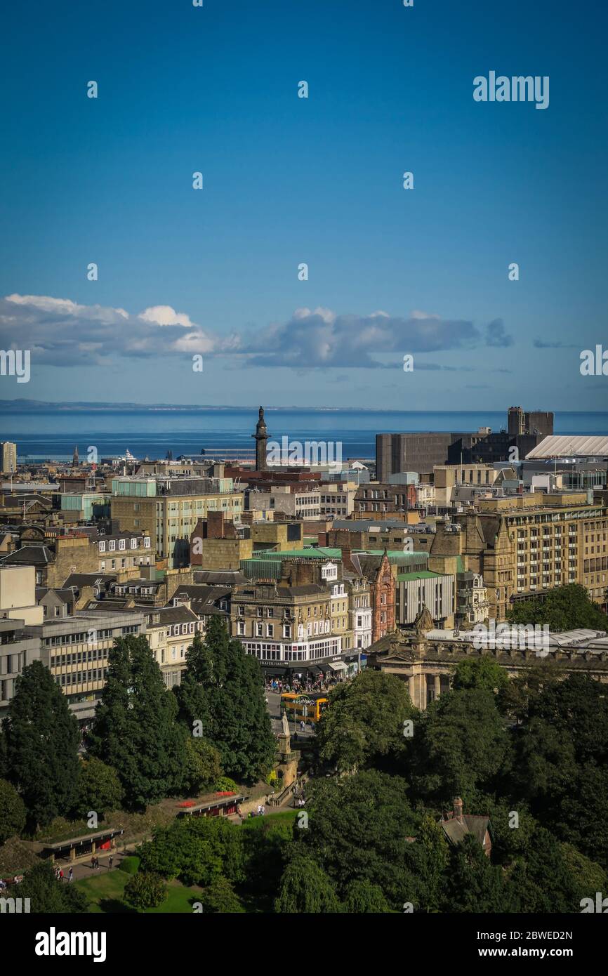 A view of Princess Street and gardens from the ramparts of Edinburgh ...
