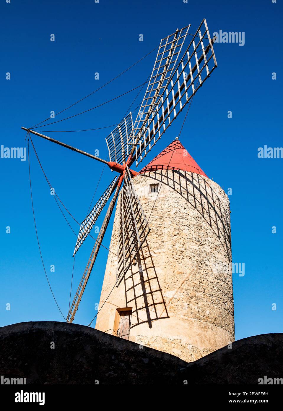Old style flour windmill against a clear blue sky at Agaida in Mallorca ...