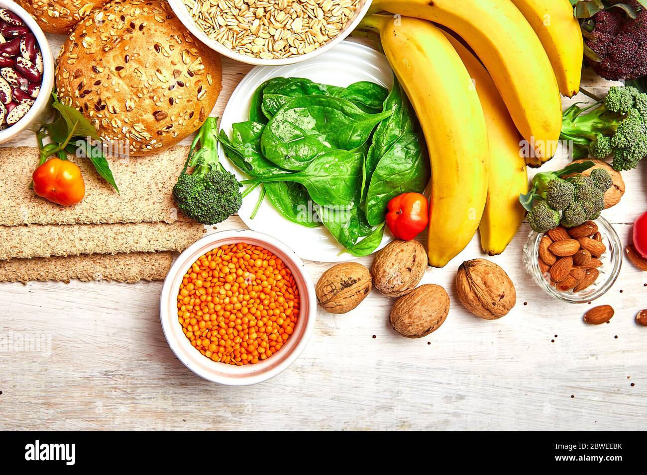 Selection food rich in fiber on white wooden background Stock Photo - Alamy