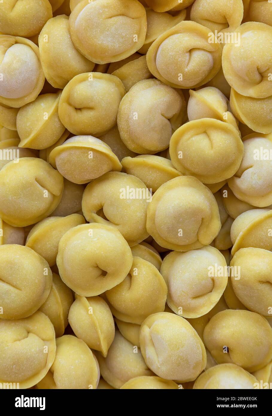 Frozen yellow dumplings texture in a market fridge Stock Photo - Alamy