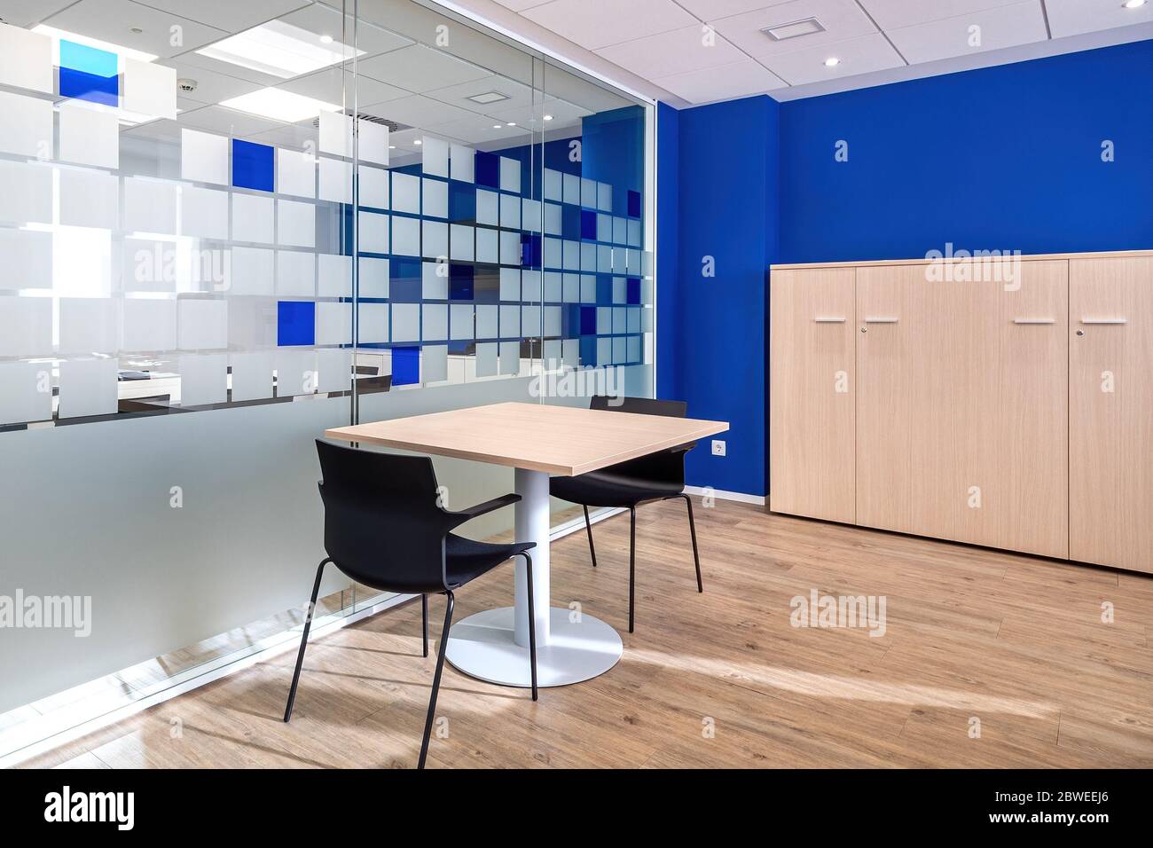 Empty conversation room with table and chairs in modern office interior ...