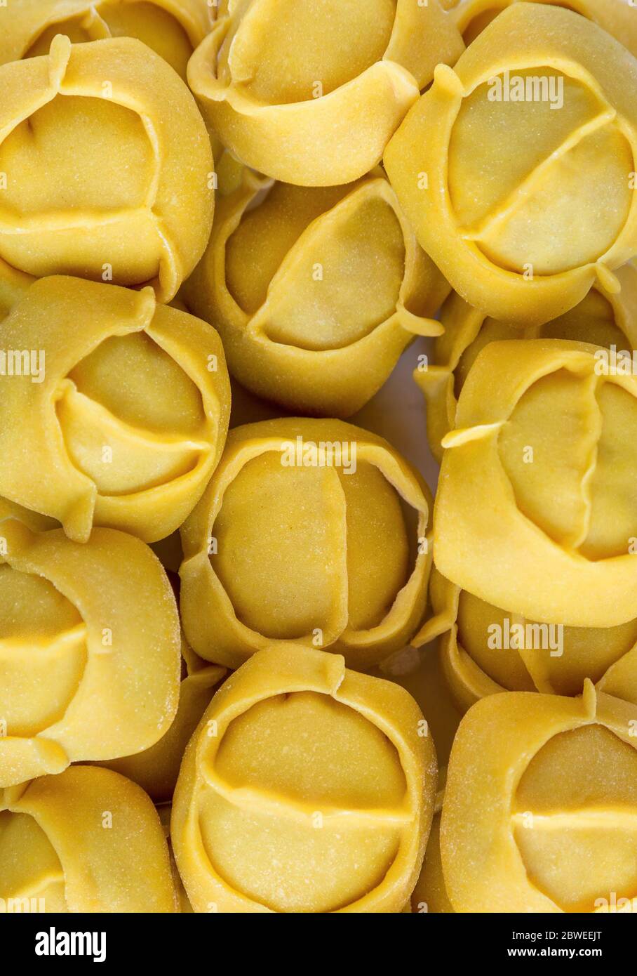 Frozen big yellow dumplings texture in a market fridge Stock Photo - Alamy