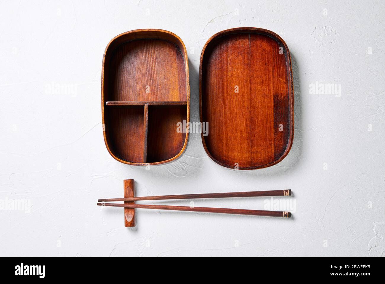 Open wooden bento box. with wooden sticks. Concept of hungry times or ...
