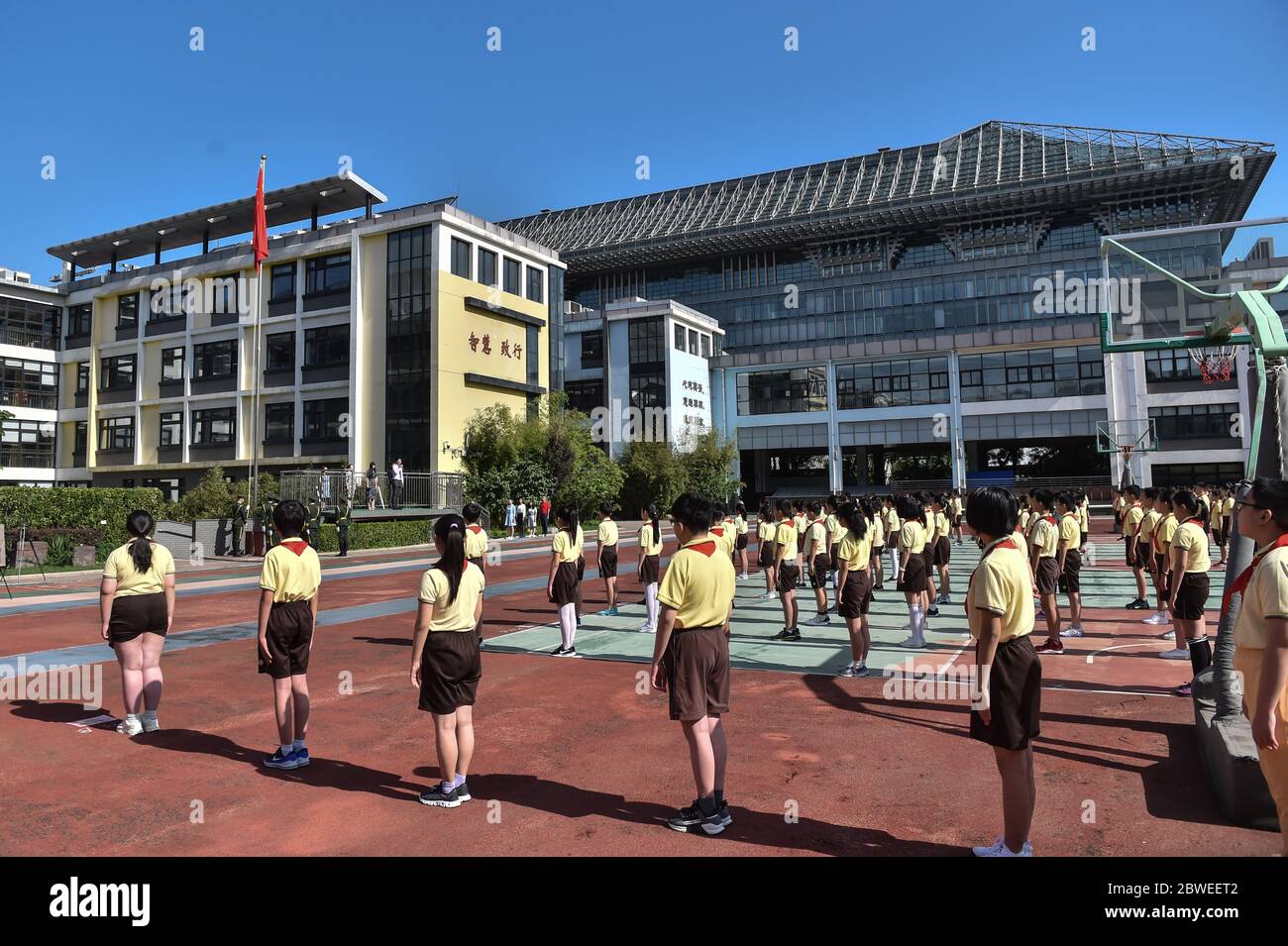 Beijing, China. 1st June, 2020. Students take part in a flag-raising ...