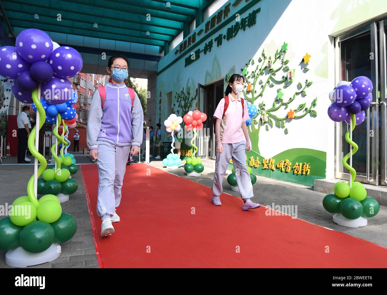 Beijing, China. 1st June, 2020. Students enter the campus of ...