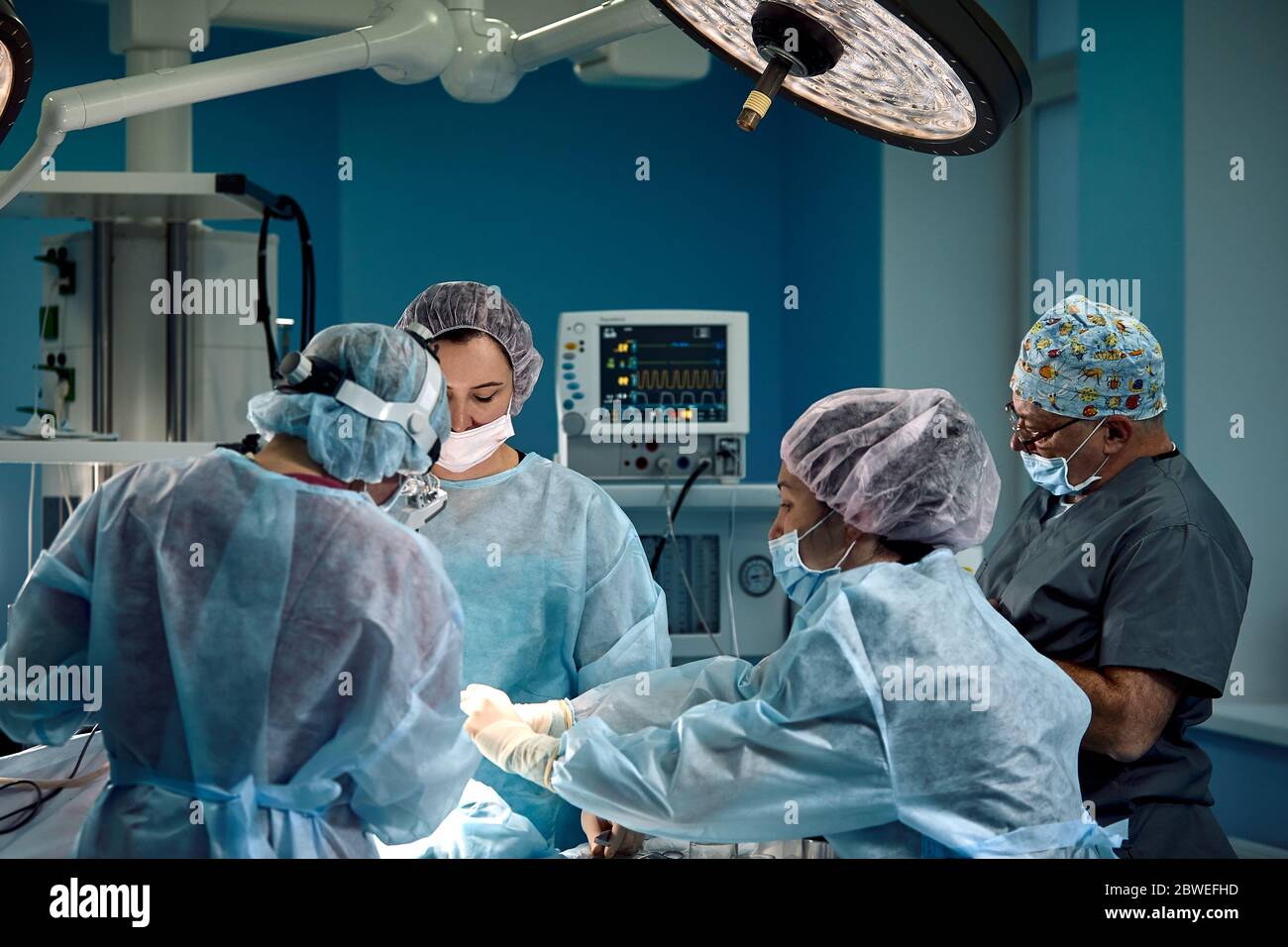 An international team of doctors during a real operation. saving lives ...