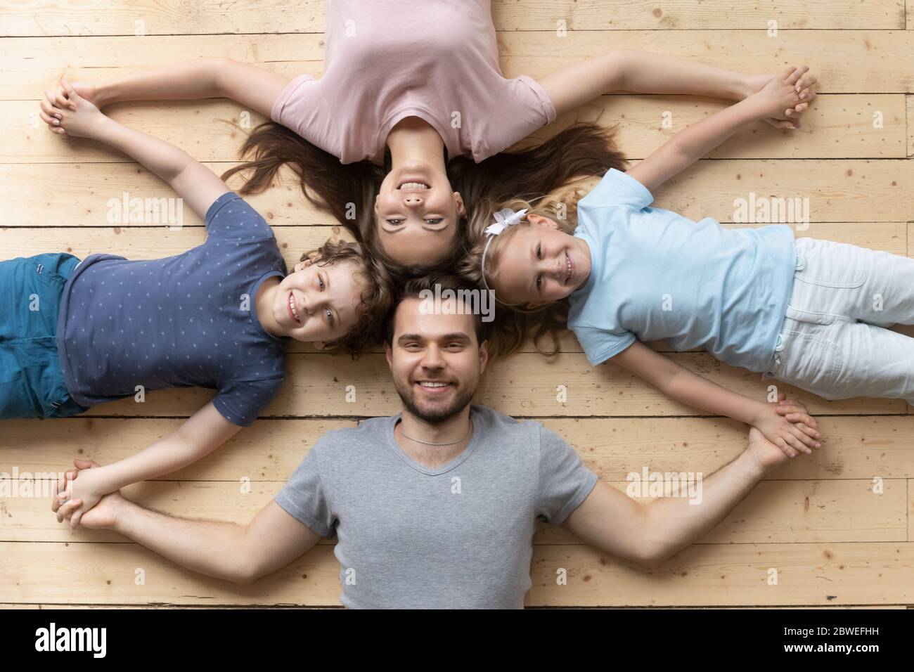 Portrait of young family with kids show unity Stock Photo - Alamy