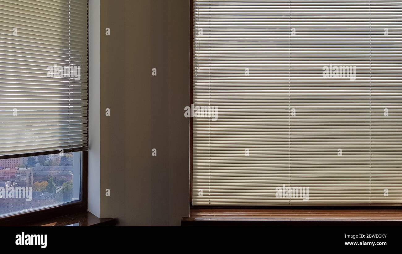 Blinds are attached to the window to protect from heat and sunlight ...