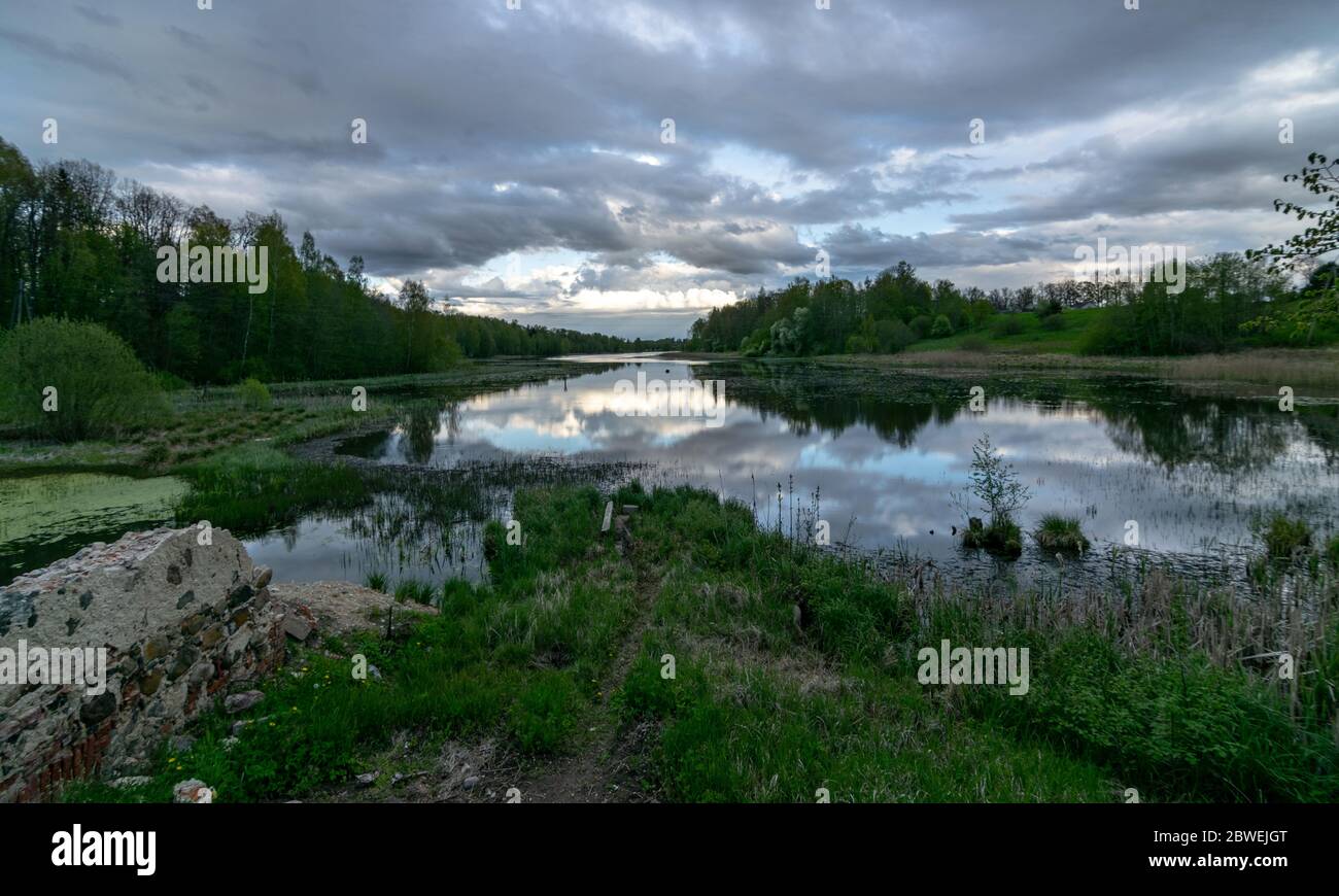 colorful spring landscape with beautiful sky, clouds and tree ...