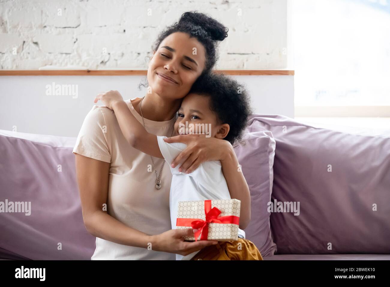 African son makes surprise to mom on Mothers day Stock Photo - Alamy