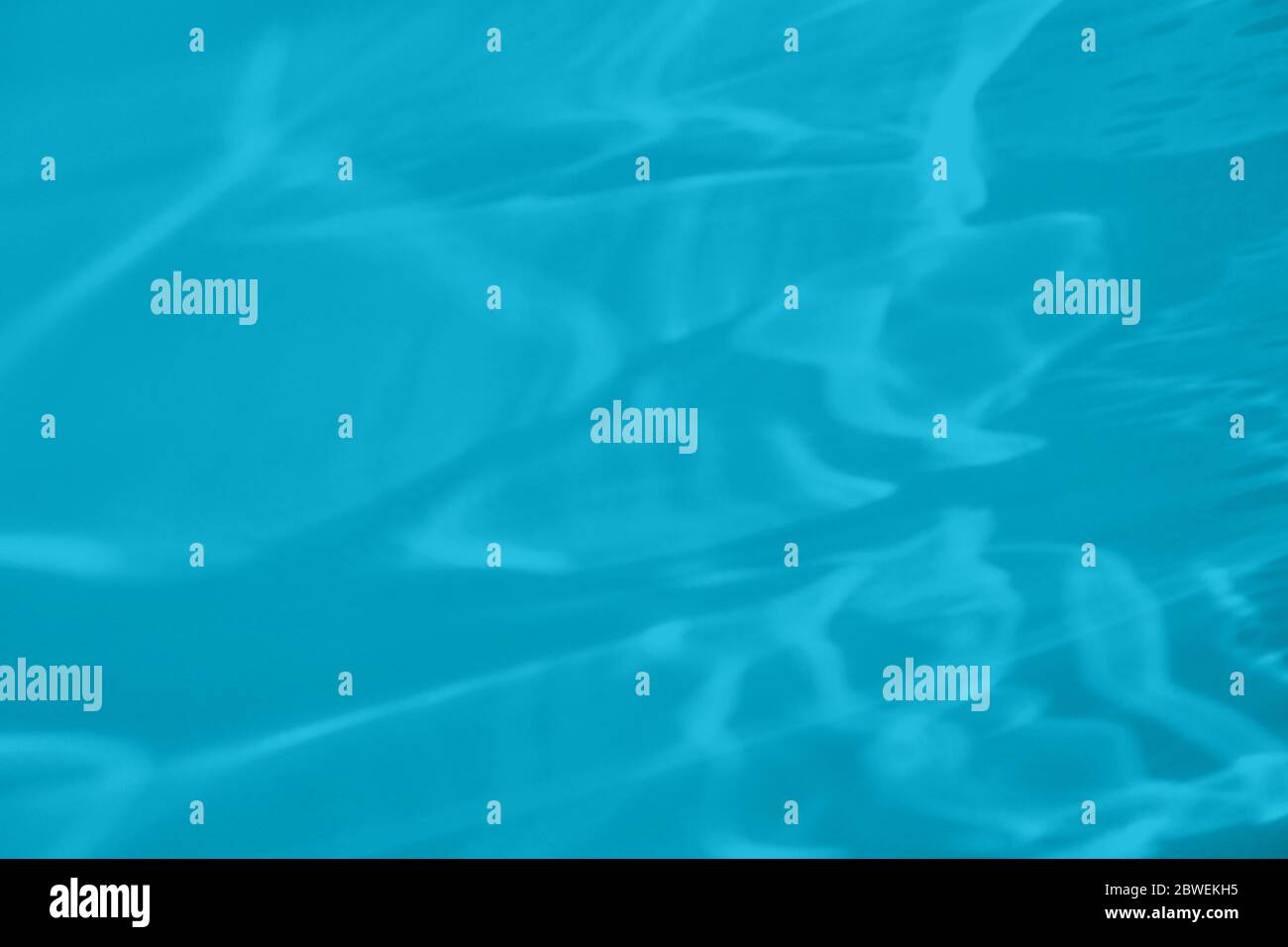 mint blue colored abstract background with light and shadows caustic ...